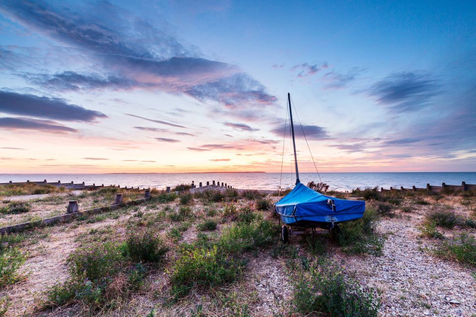 Lone boat on the shingle beach at Whitstable, Kent